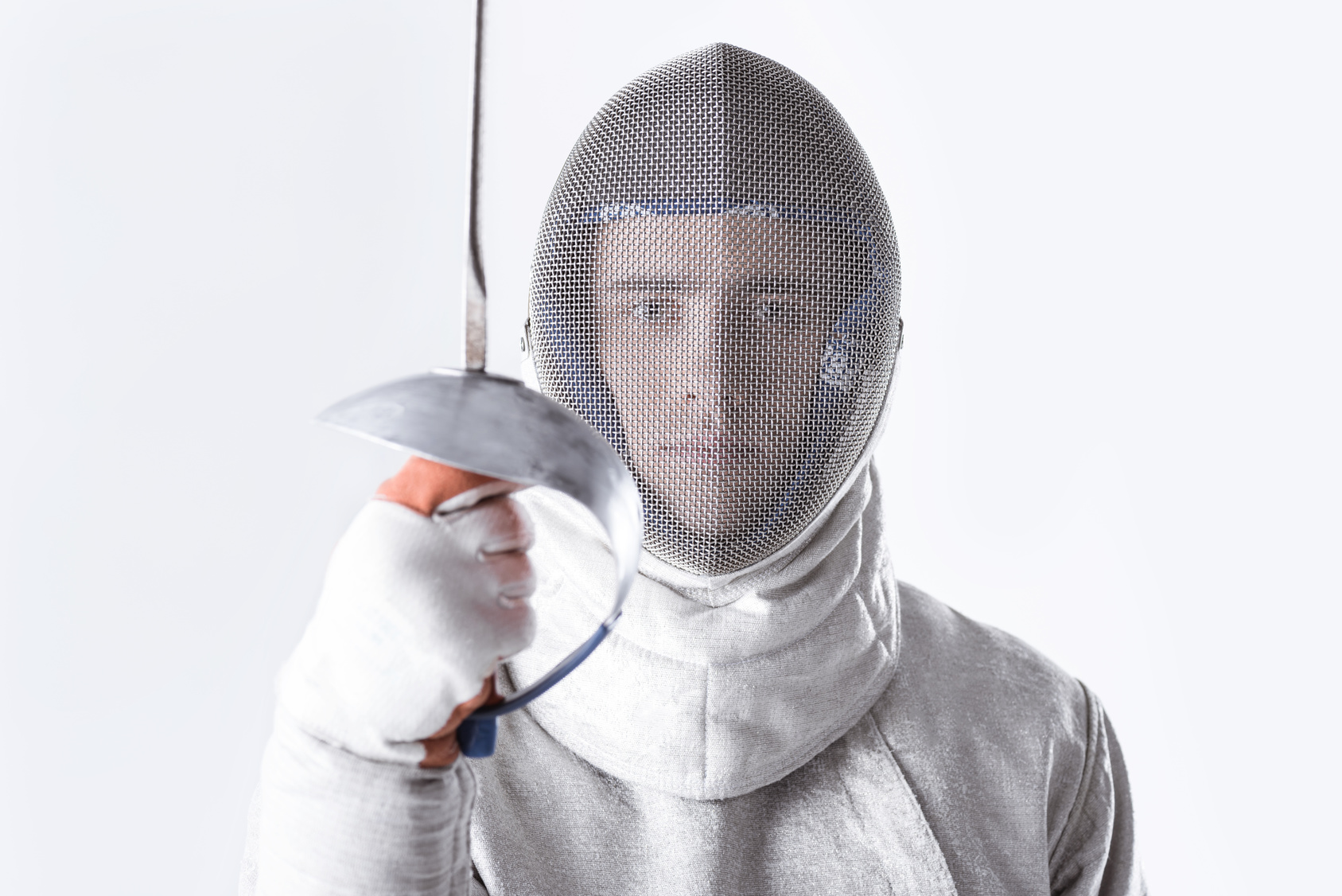 portrait of fencer in uniform holding rapier in hand on white - Fence